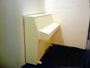 Zender small modern Piano in a white satin polished cabinet